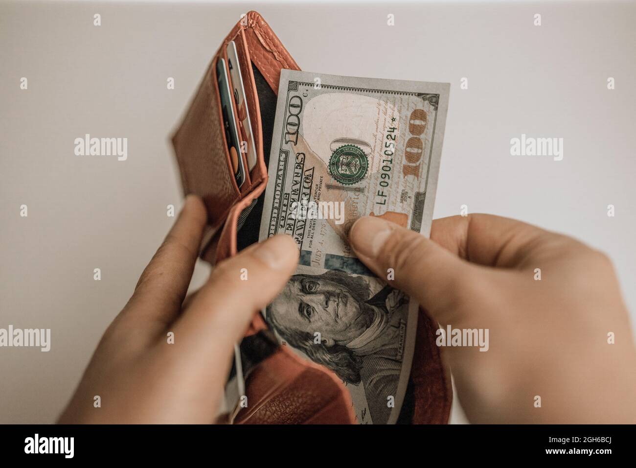 Hands taking out money from wallet. Man counting money, economy concept ...