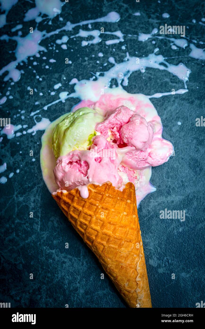 Melted ice cream lying on the ground Stock Photo - Alamy