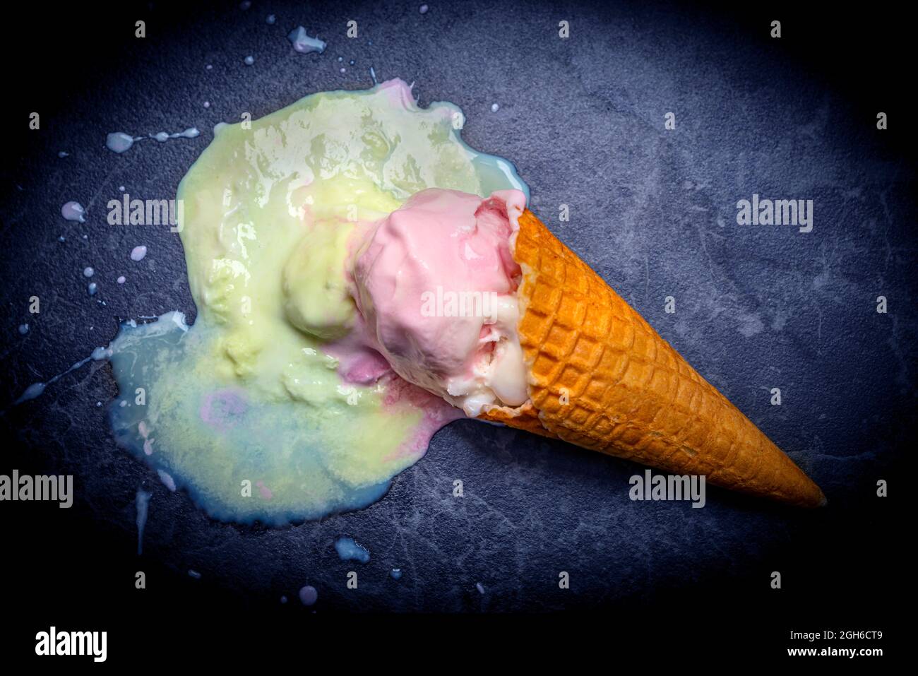 Melted ice cream lying on the ground Stock Photo - Alamy