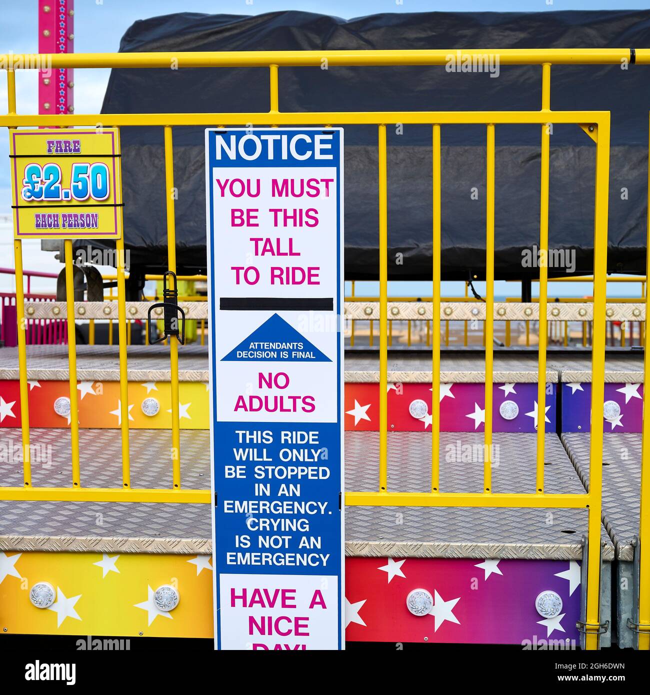 Sign in front of childs ride on funfair Stock Photo - Alamy