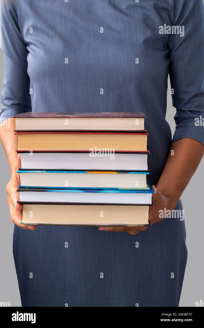 Girl holding stack paper hi-res stock photography and images - Alamy