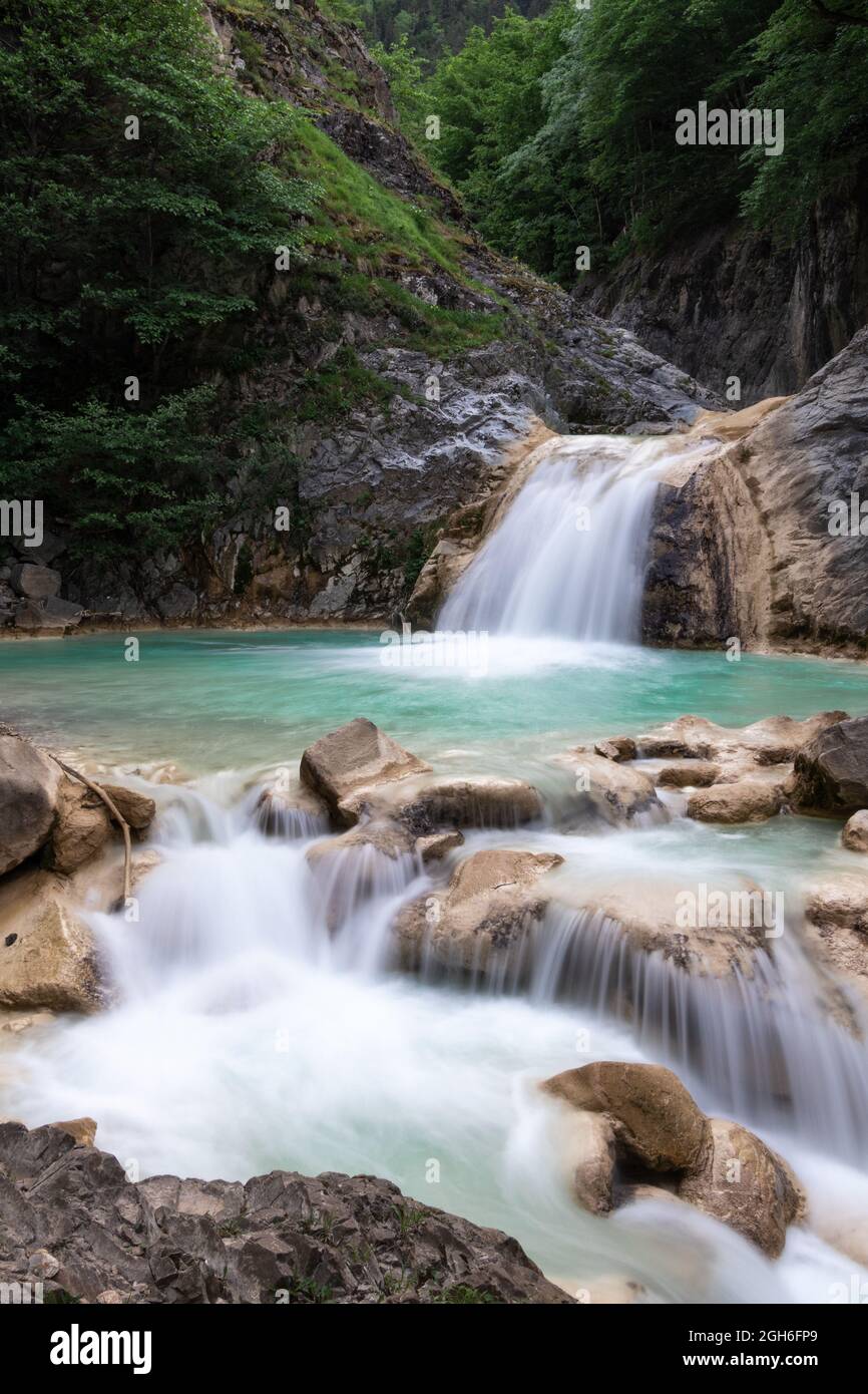 Scenic Blue Waterfall in the Green Forest Stock Photo - Alamy
