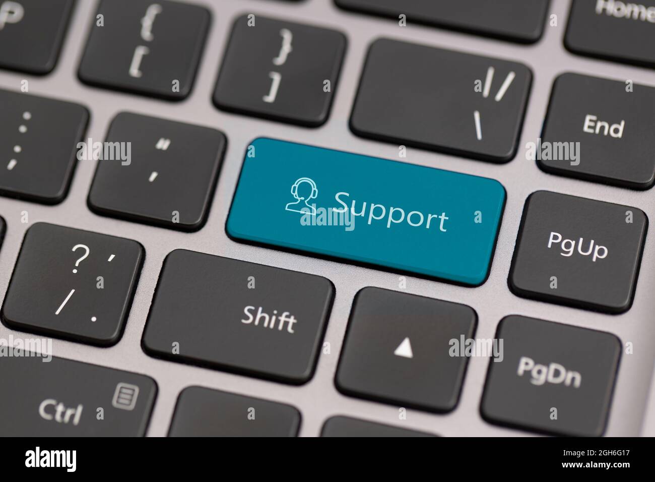 Button with the word support on a keyboard Stock Photo - Alamy