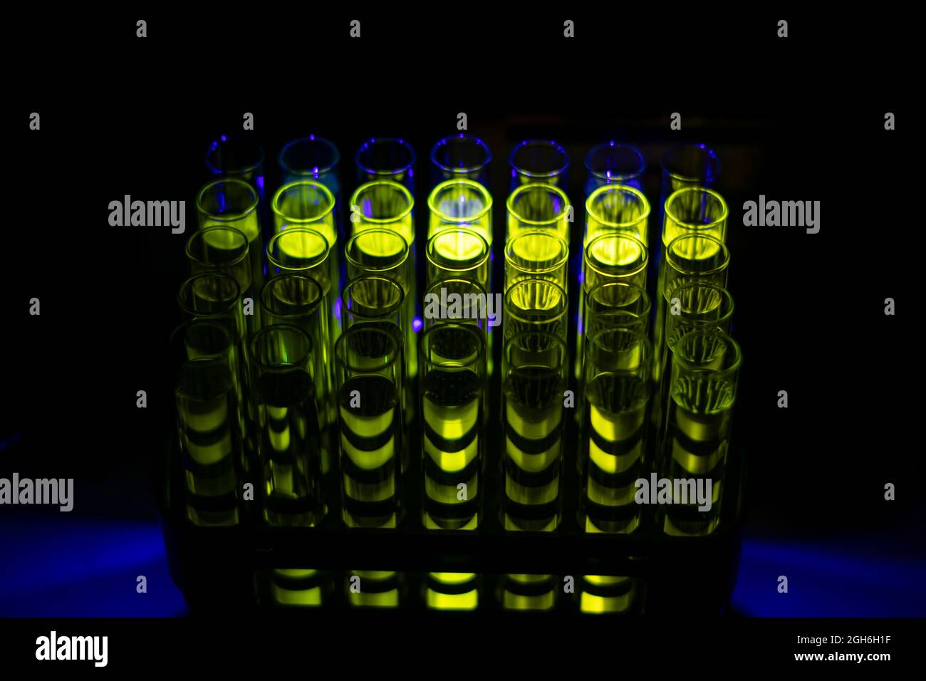Fluorescent green organic compound solution collected from column ...