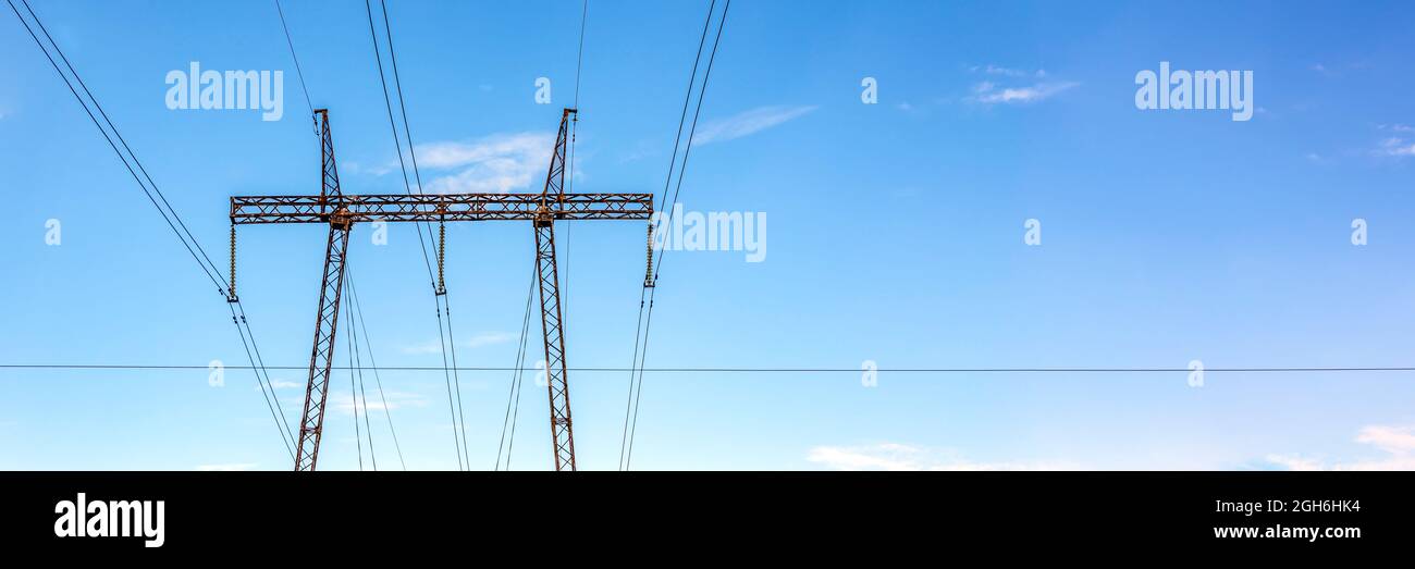 High voltage pillar. Power grid pole against the sky. High voltage ...
