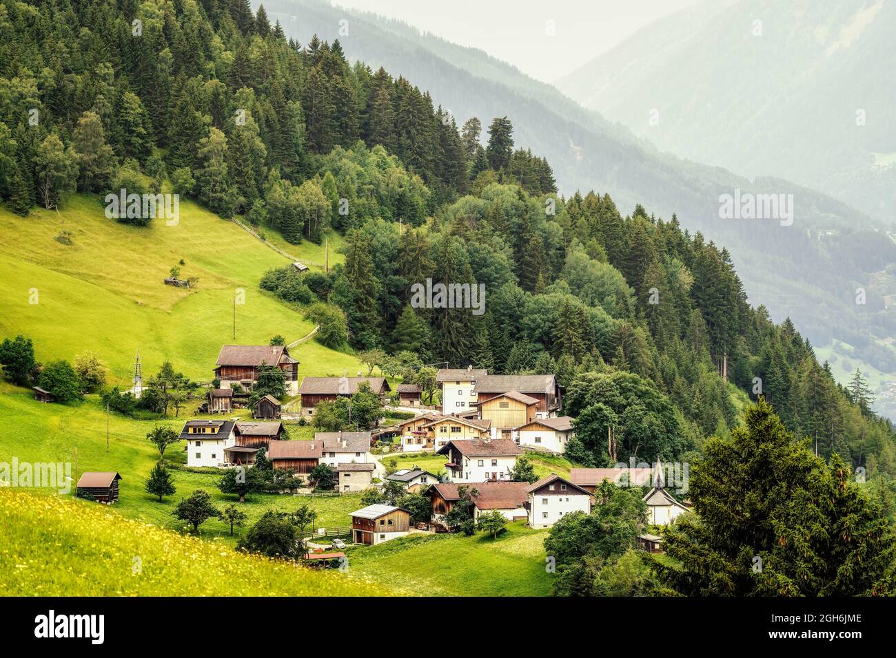 A beautiful shot of a small village on a hilltop surrounded by ...