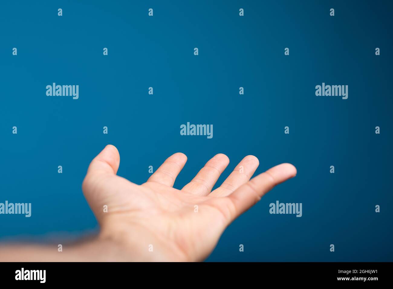 A male outstretched hand with an open palm Stock Photo - Alamy