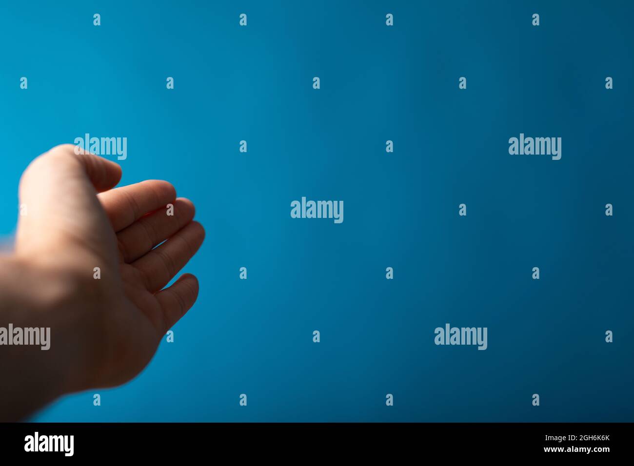 A male outstretched hand with an open palm Stock Photo - Alamy