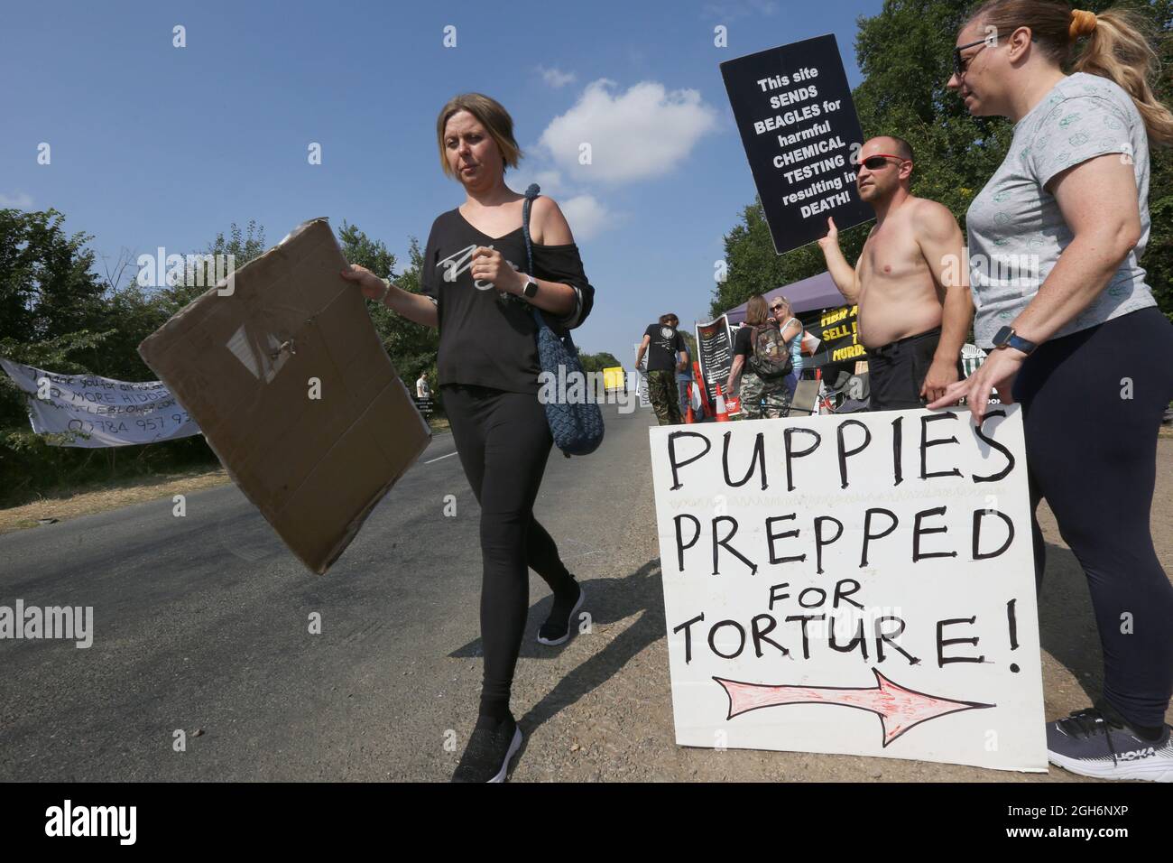 Protesters hold up placards during the protest at Camp Beagle. 67 days ...