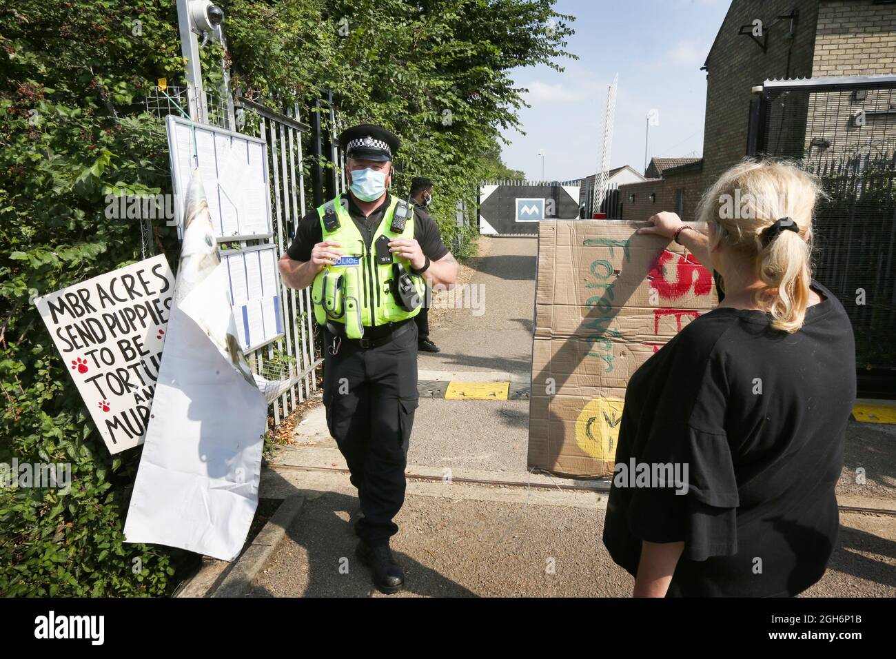 A police officer attends to oversee staff leaving during the protest ...