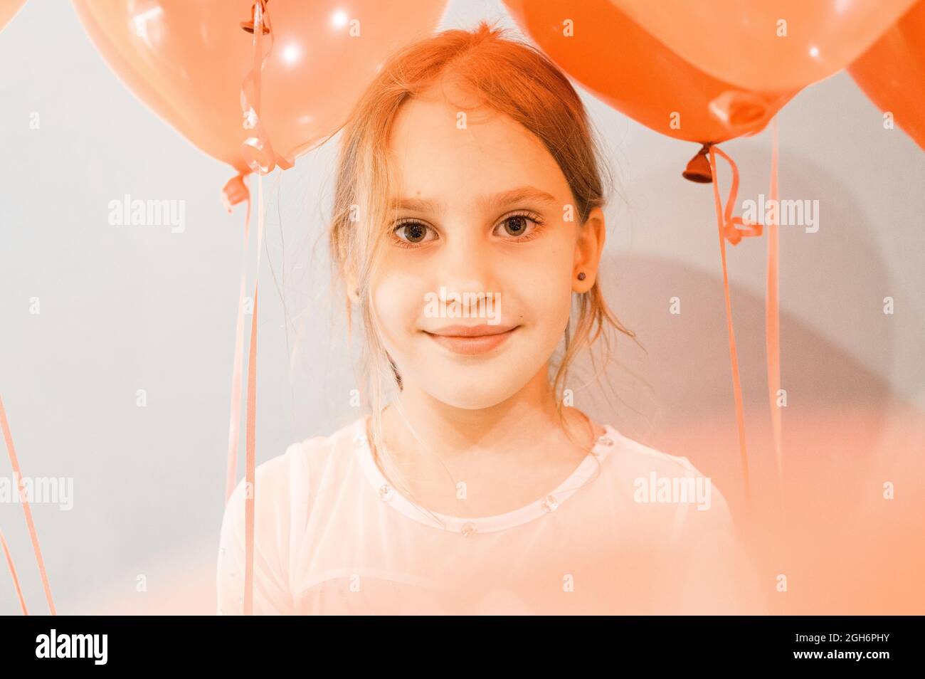 portrait of a cute little happy candid smiling caucasian eight year old ...