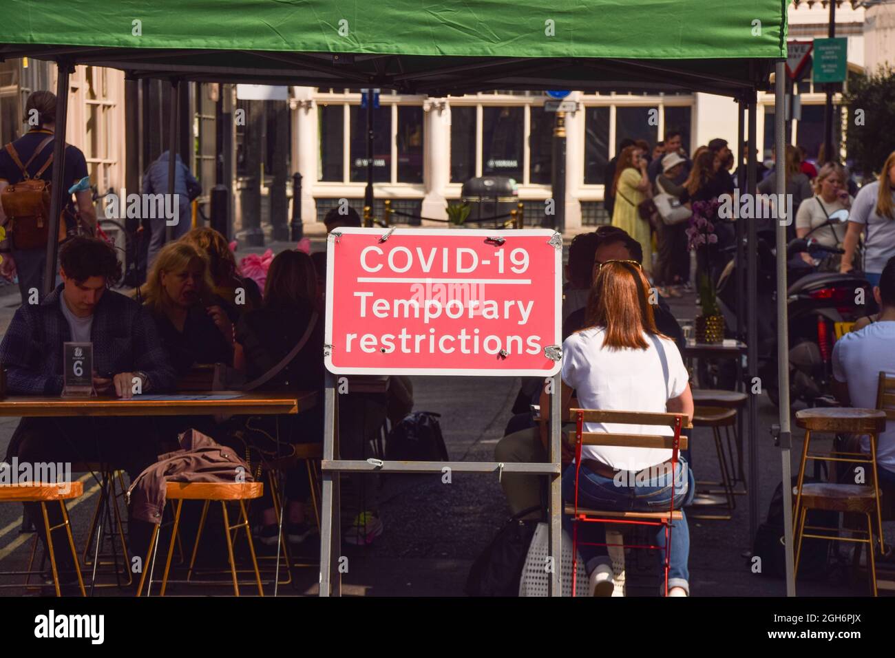 London, UK. 05th Sep, 2021. A 'COVID-19 Temporary Restrictions' sign is ...