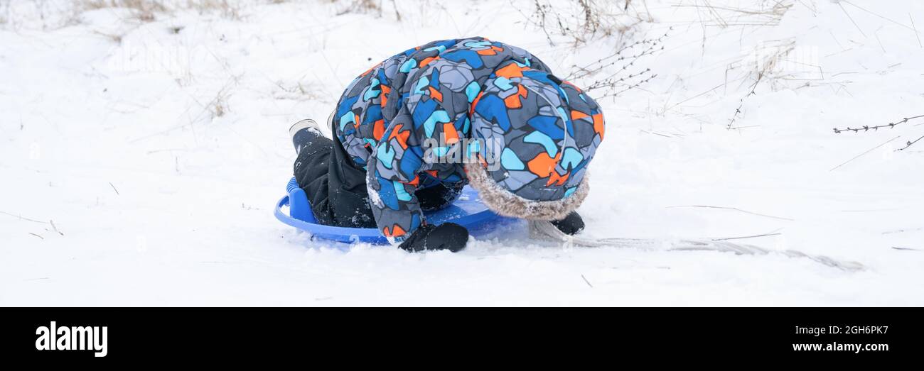 a happy faceless little five year old boy is activity and fun spending ...