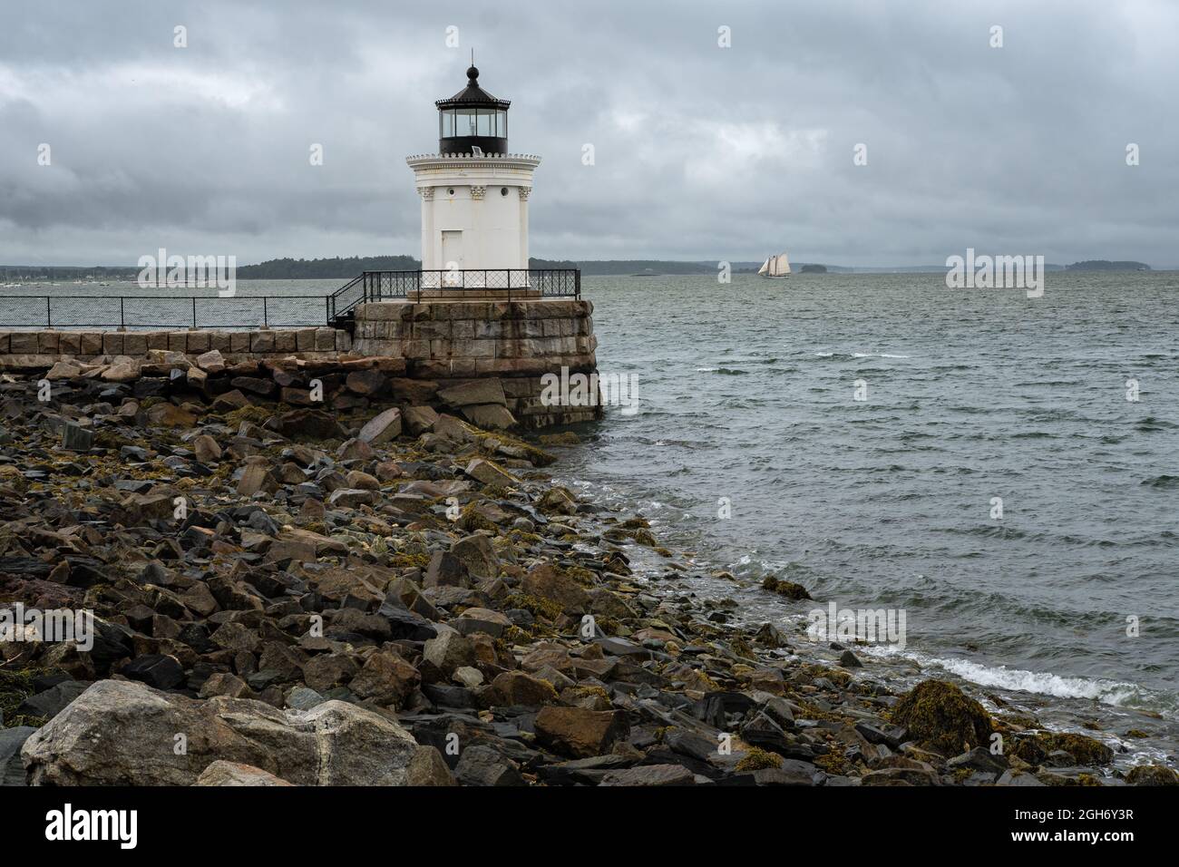 A Portland breakwater lighthouse at Bug Light Park on a gloomy day ...
