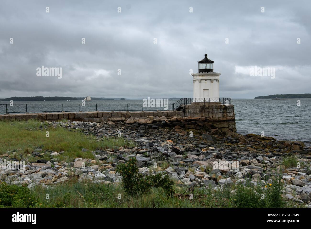 A Portland breakwater lighthouse at Bug Light Park on a gloomy day ...
