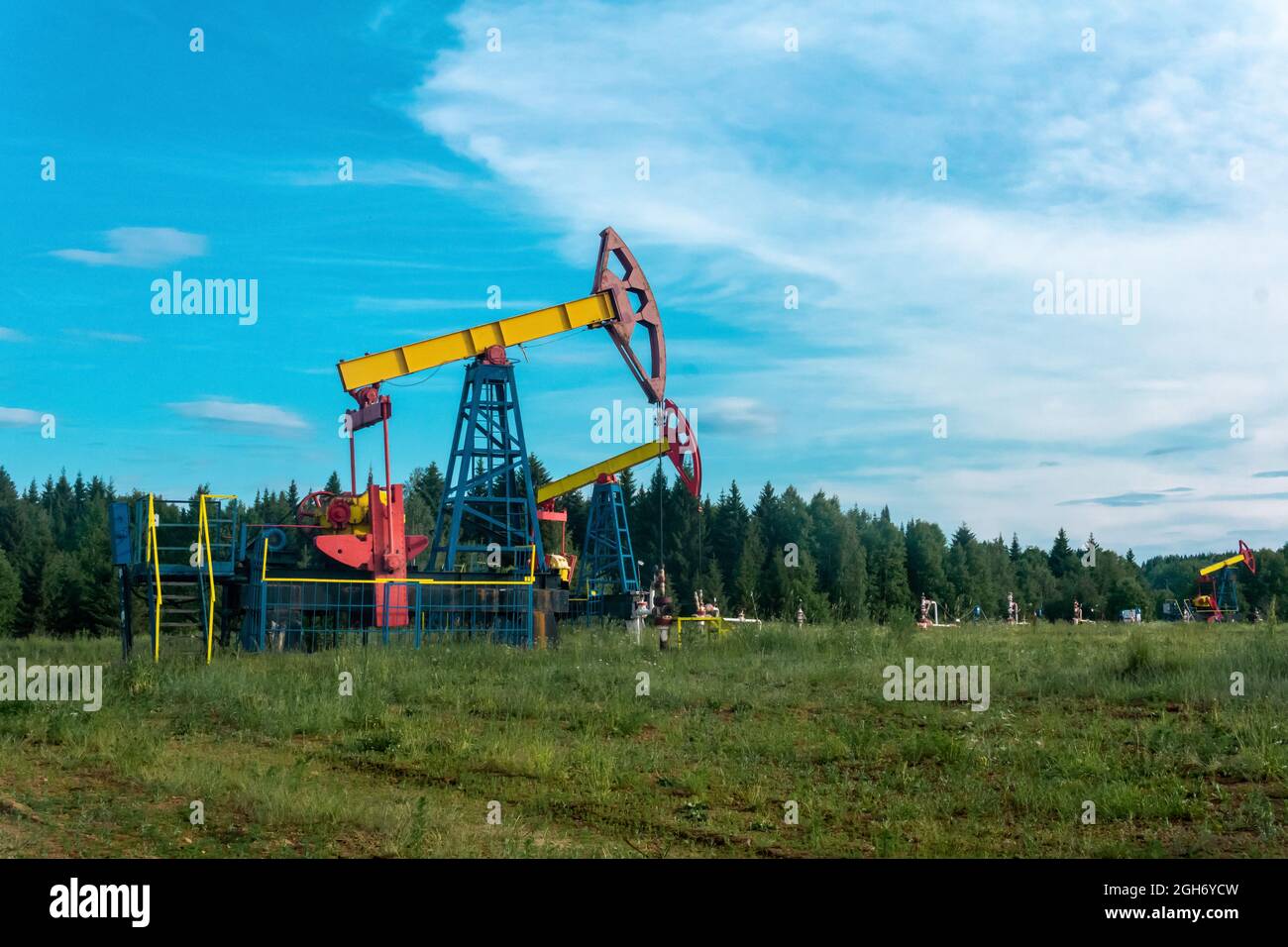 oil pumping stations in a clearing in the forest Stock Photo - Alamy