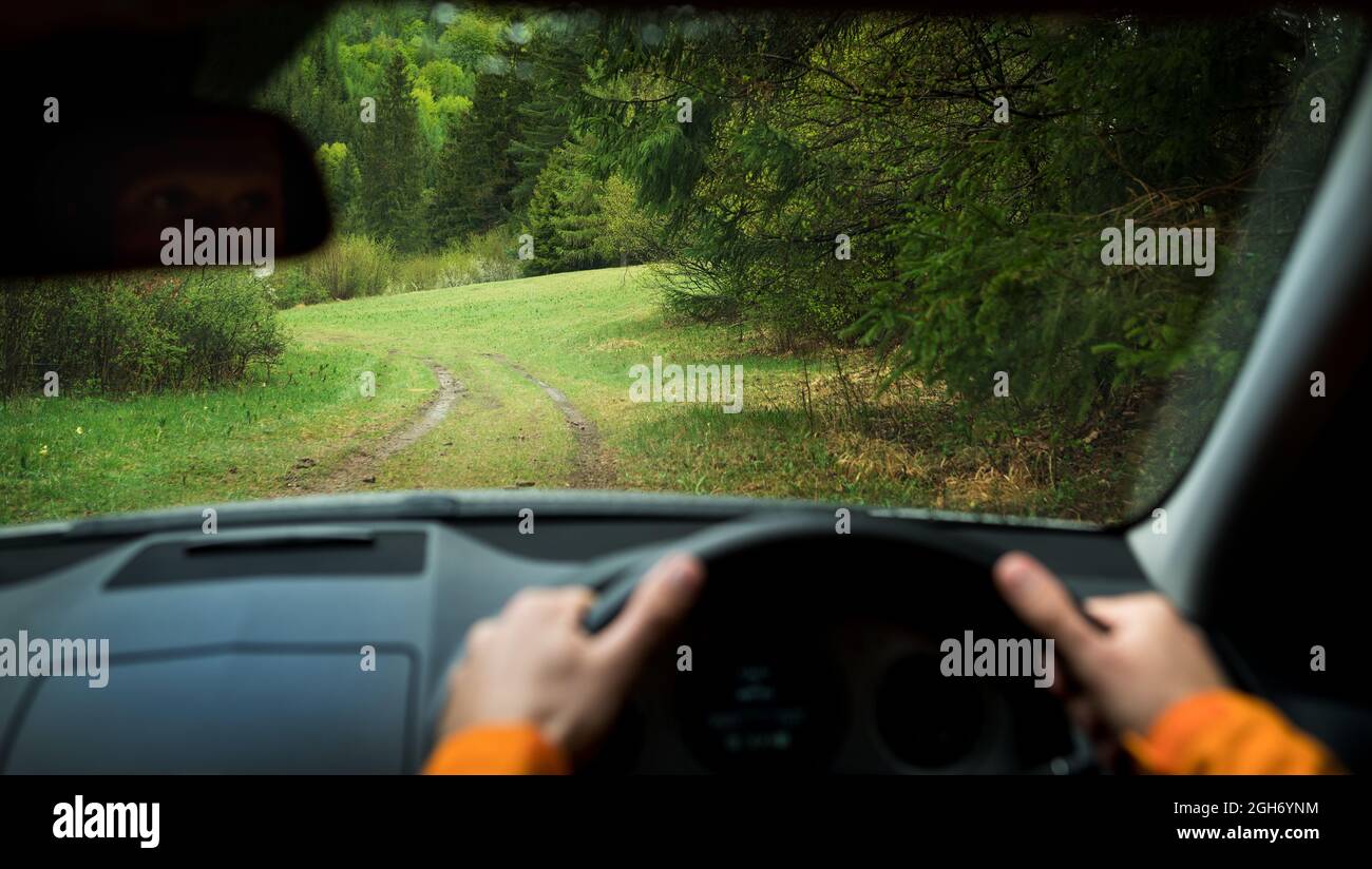 Driver driving a modern off road right hand drive RHD car on the ...