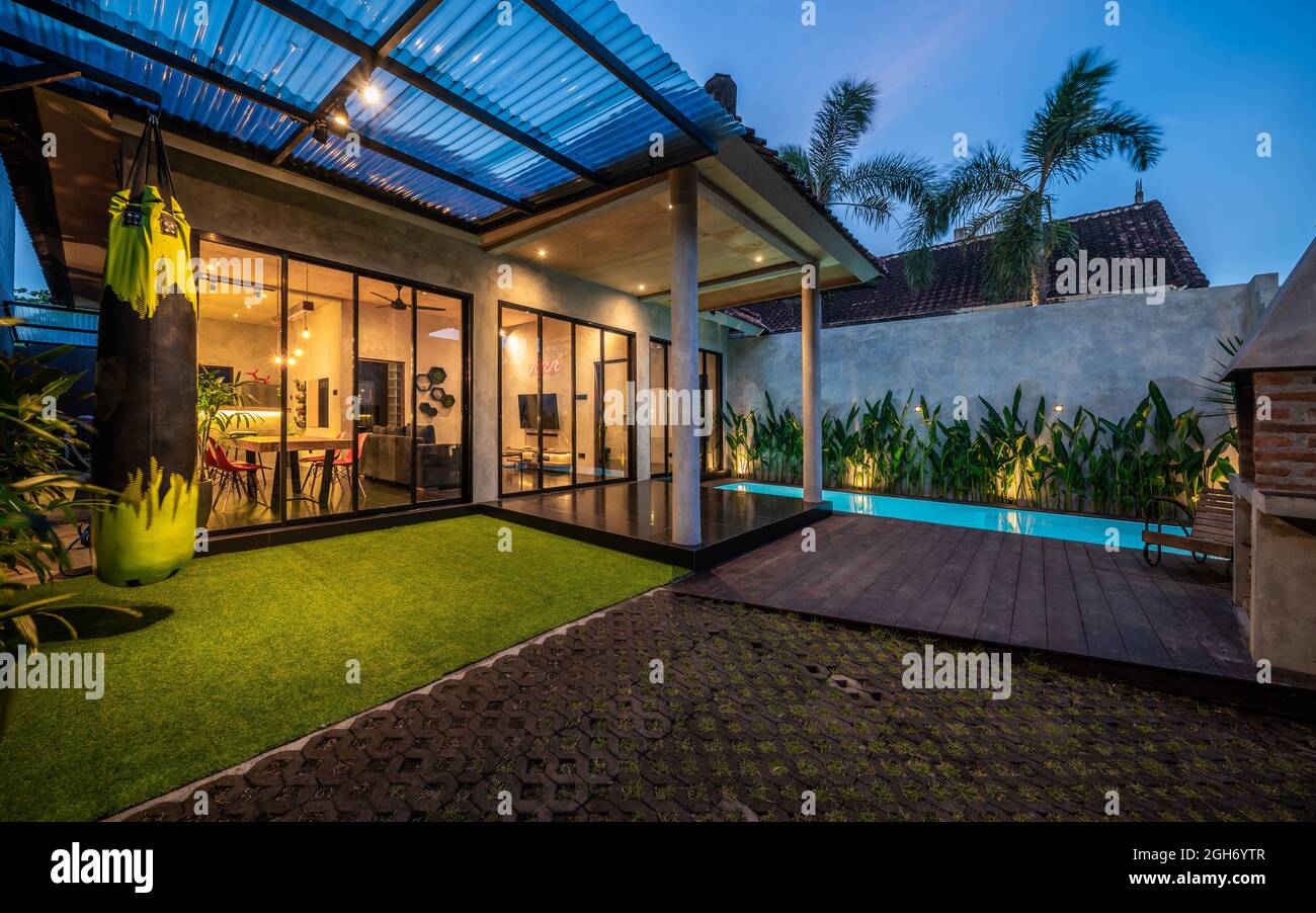 Modern villa, night scene, view from poolside Stock Photo - Alamy