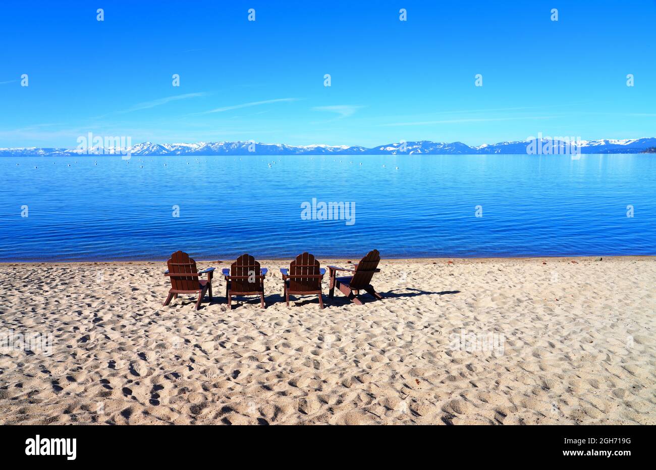 Landscape view of Lake Tahoe with snow-covered mountains and forests ...