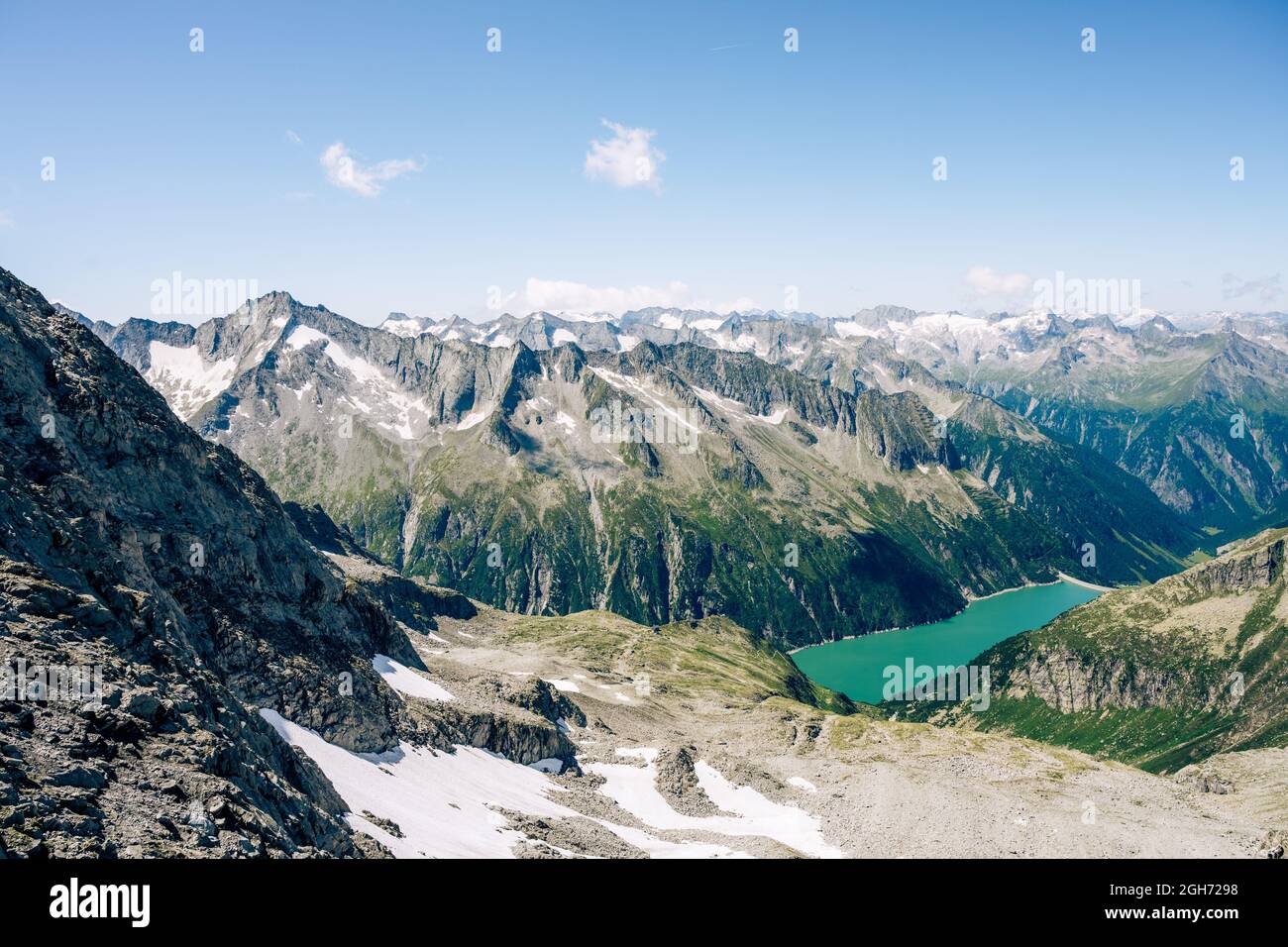 Summer alpine scenery with turquoise blue water reservoir. Zillertal ...