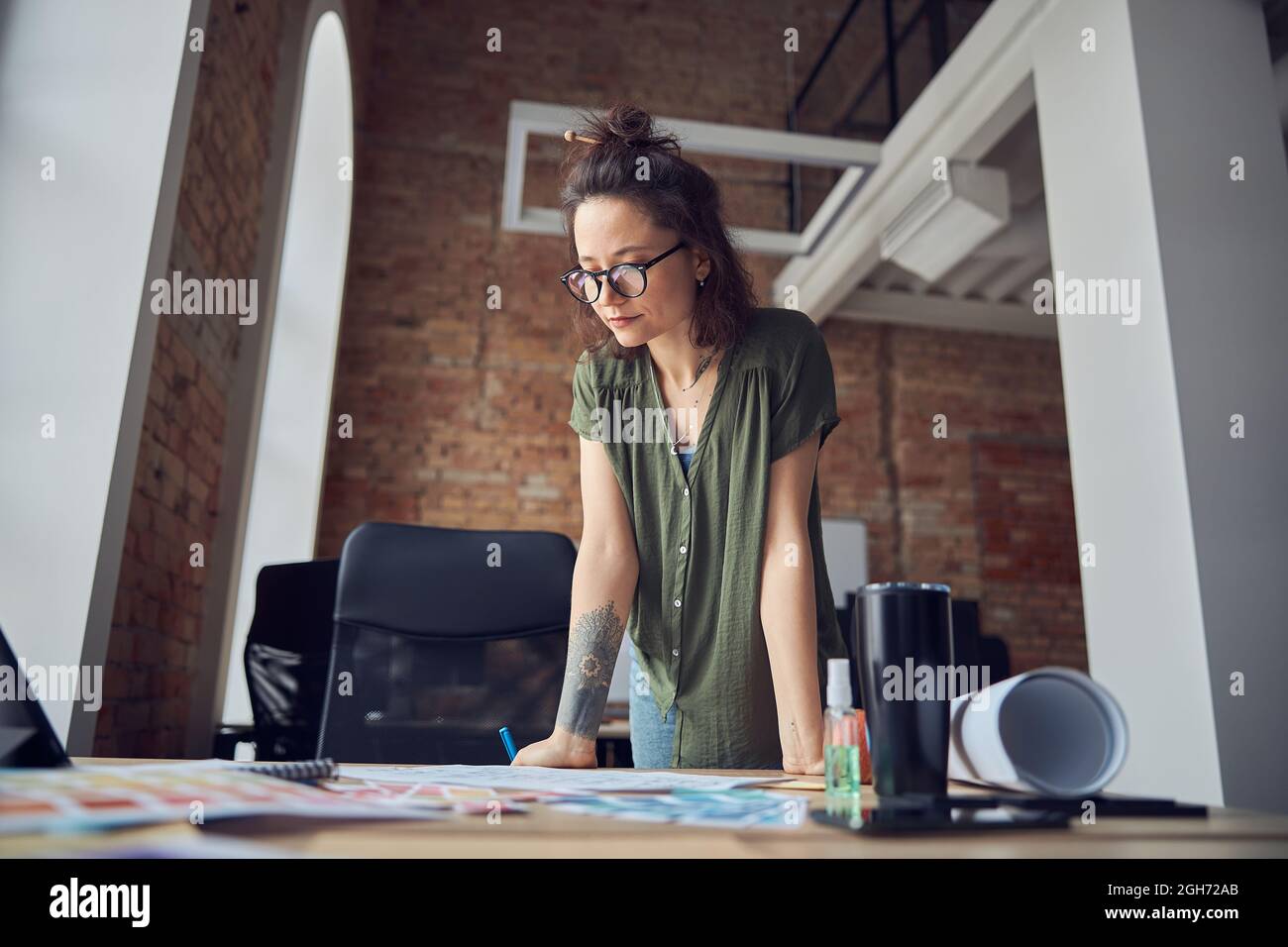 Creative woman, interior designer or architect in casual wear with ...