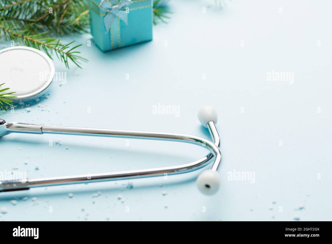 Christmas medical concept with stethoscope, gift box and christmas tree ...