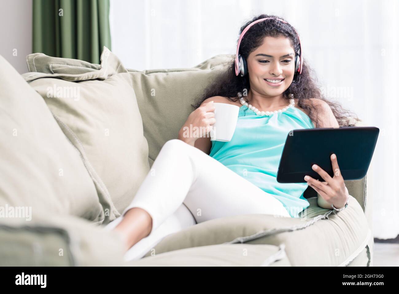 Watching videos on modern hi-res stock photography and images - Alamy