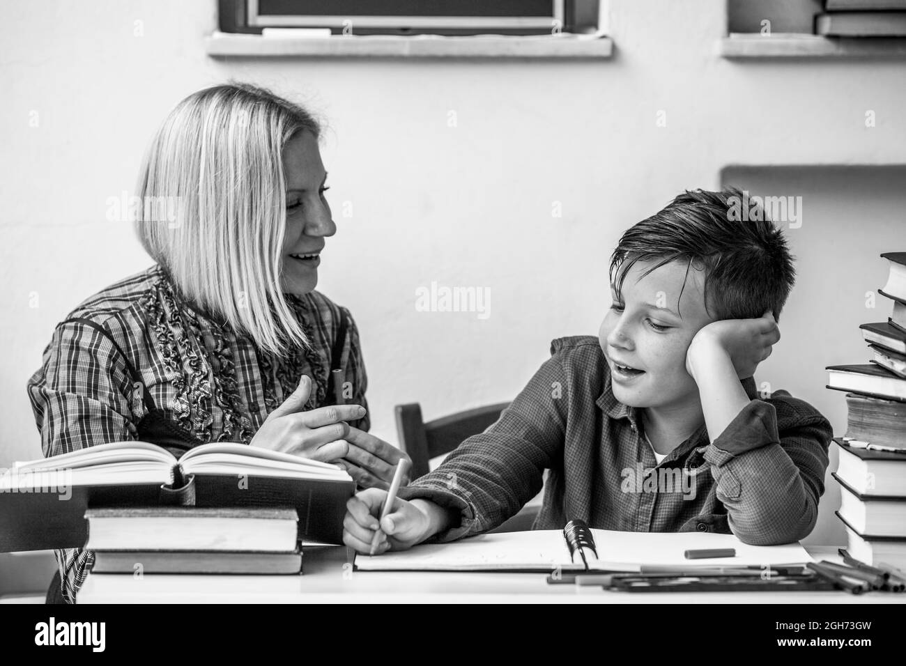 School classroom teacher help Black and White Stock Photos & Images - Alamy