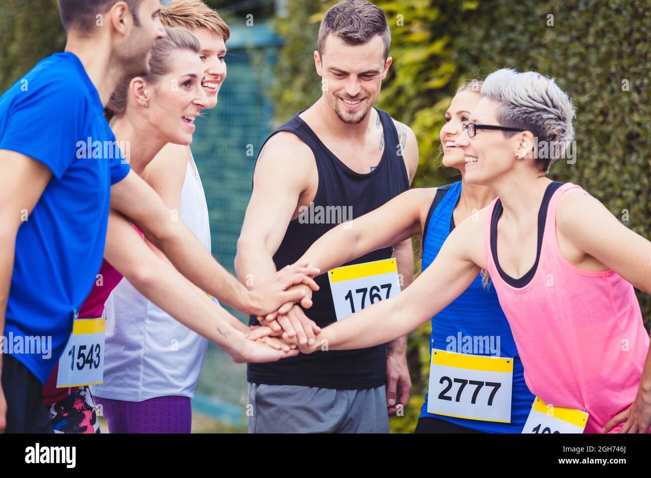 Stacking hands hi-res stock photography and images - Alamy