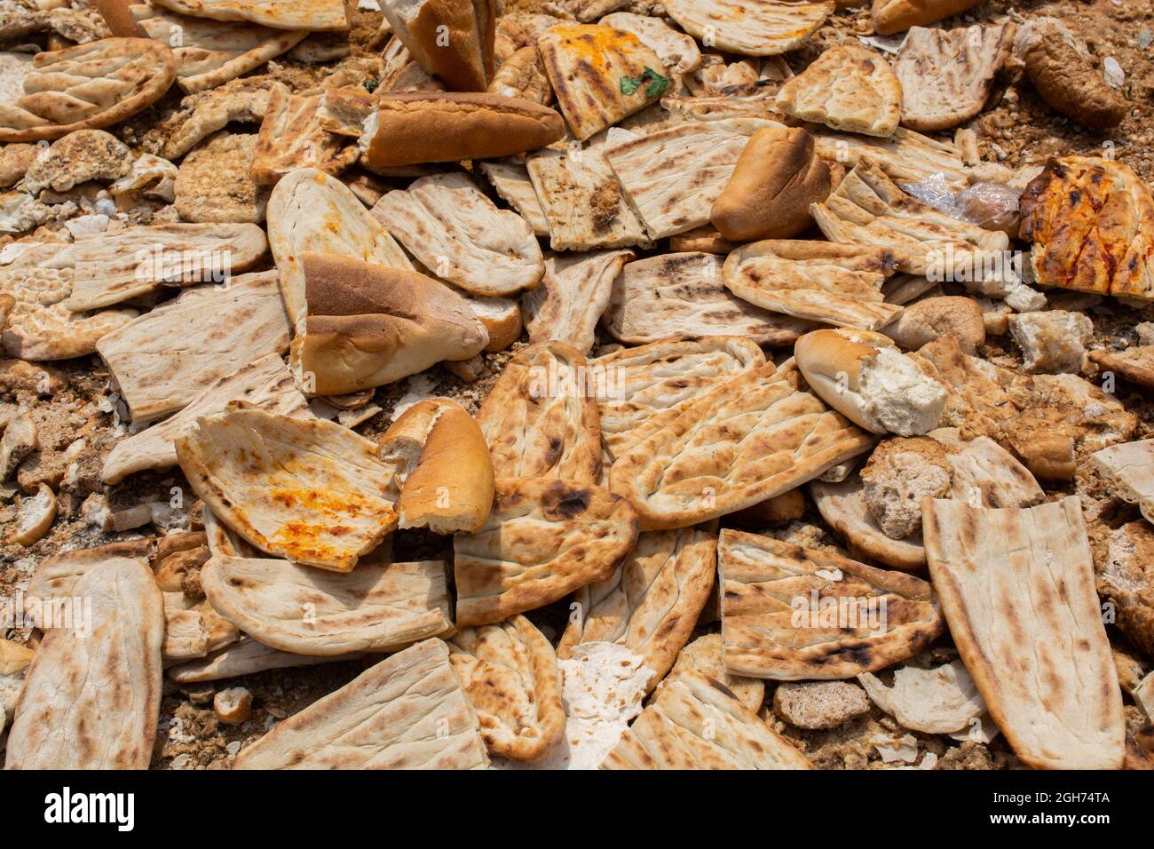 The dry bread pieces on the ground Stock Photo - Alamy