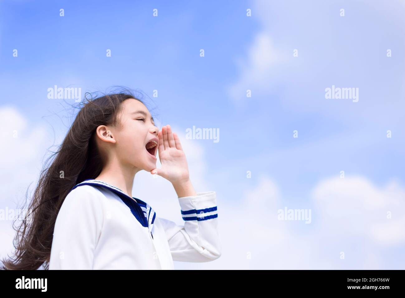 Teenager student girl shouting and announcing something Stock Photo - Alamy
