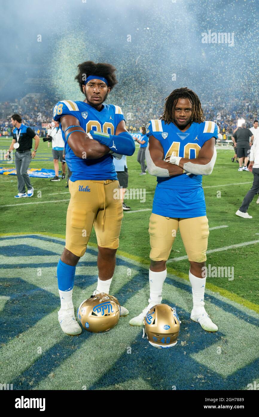 UCLA Bruins tight end Mike Martinez (88) and linebacker Caleb Johnson ...