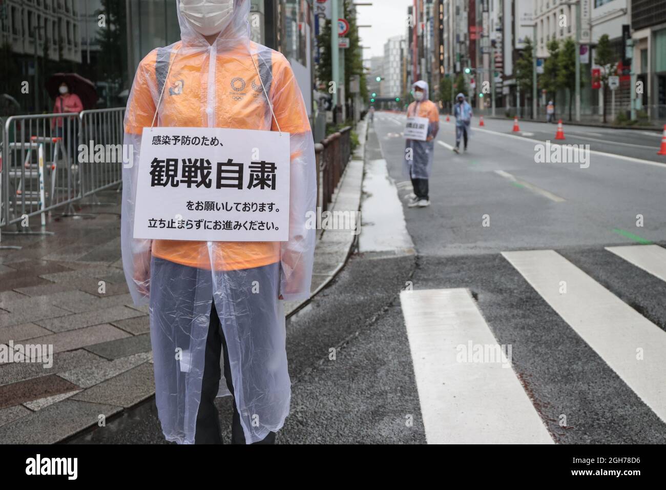 Tokyo, Japan. 5th Sep, 2021. A man wearing a sign asking people not to ...
