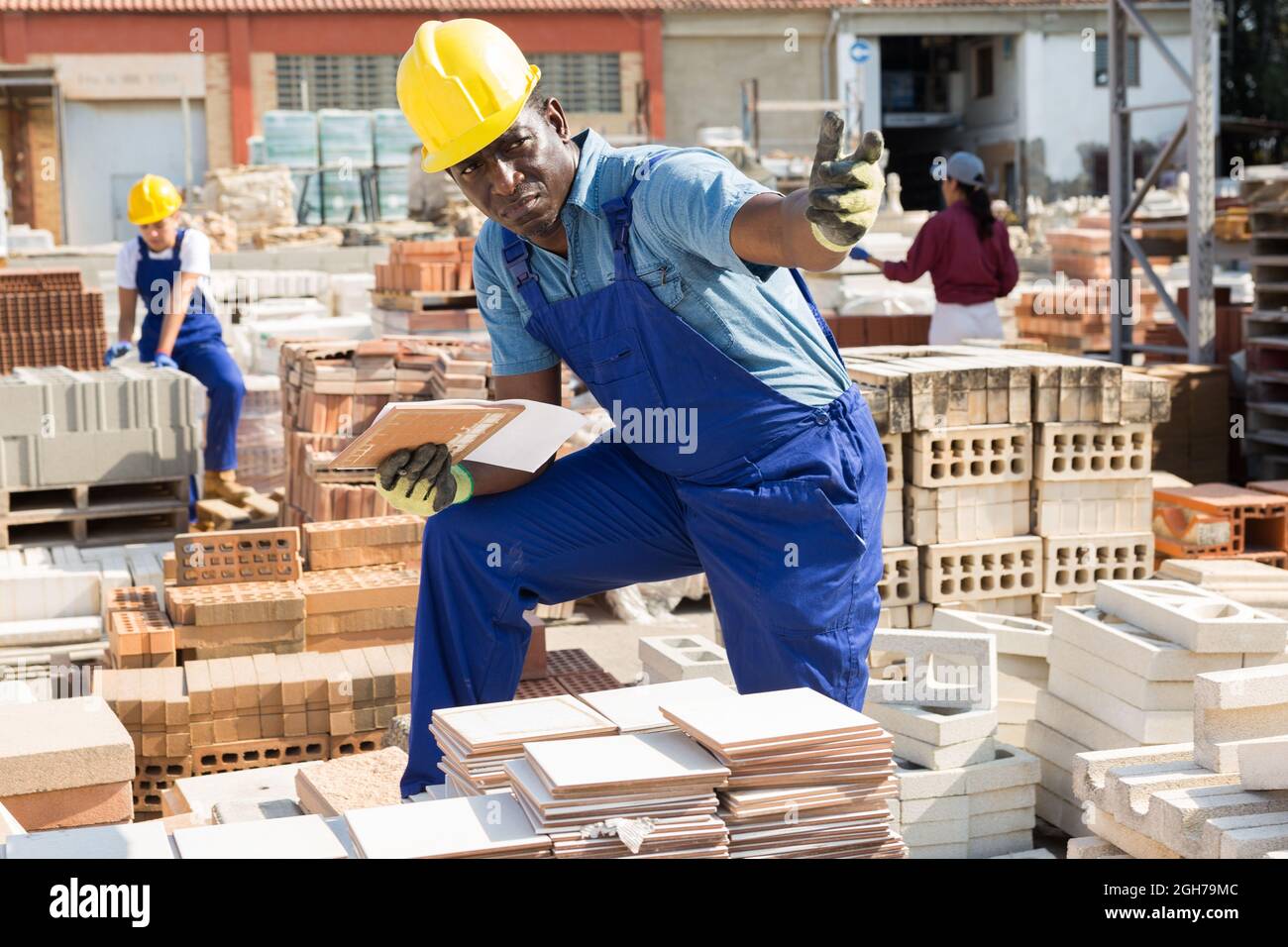 Builder choosing ceramic tiles hi-res stock photography and images - Alamy