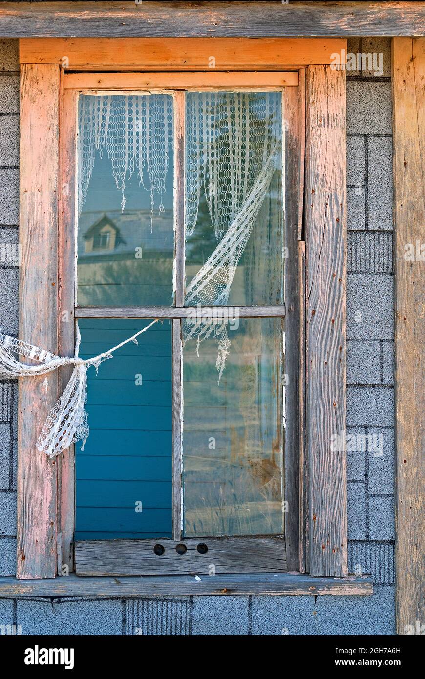 Broken window and torn curtain Stock Photo - Alamy