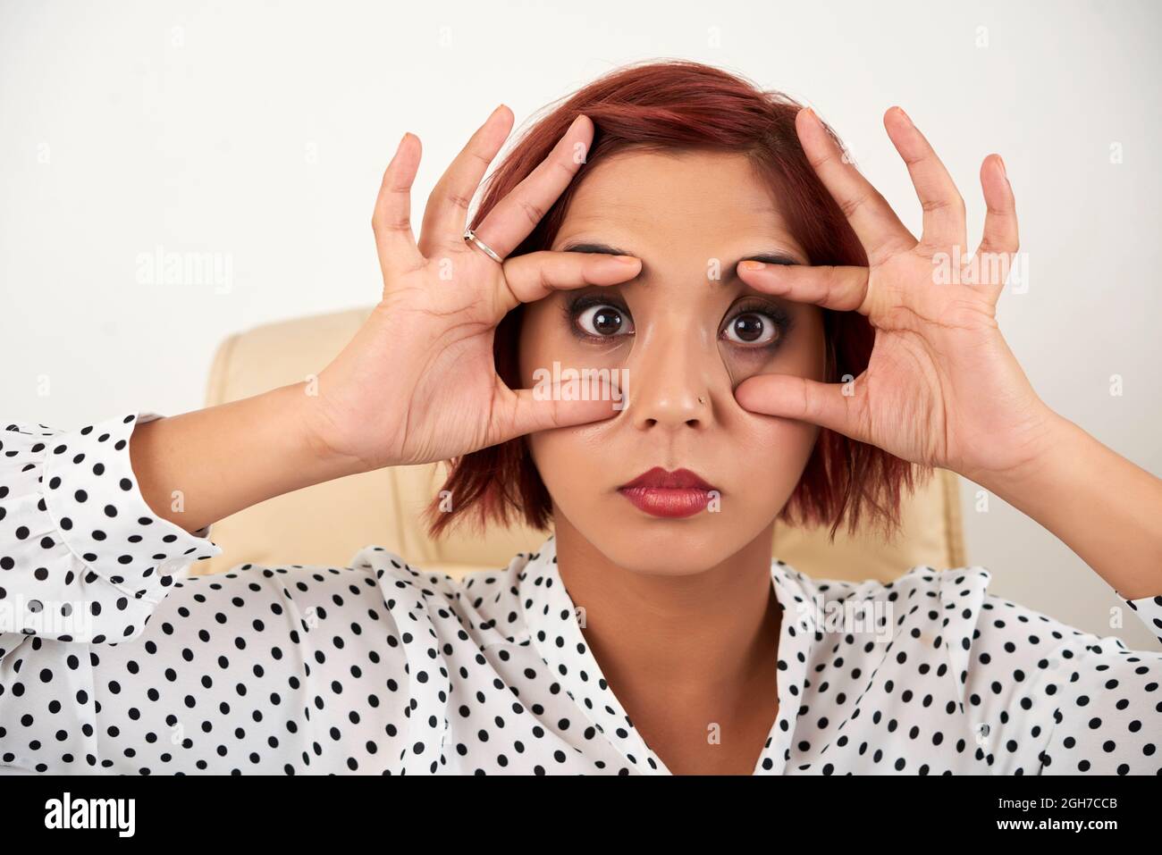 Face of tired young businesswoman trying to keep her eyes open Stock ...