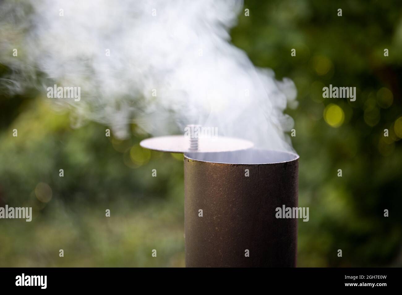 Smoky grill chimney. White smoke. Eat cooking and holidays Stock Photo ...