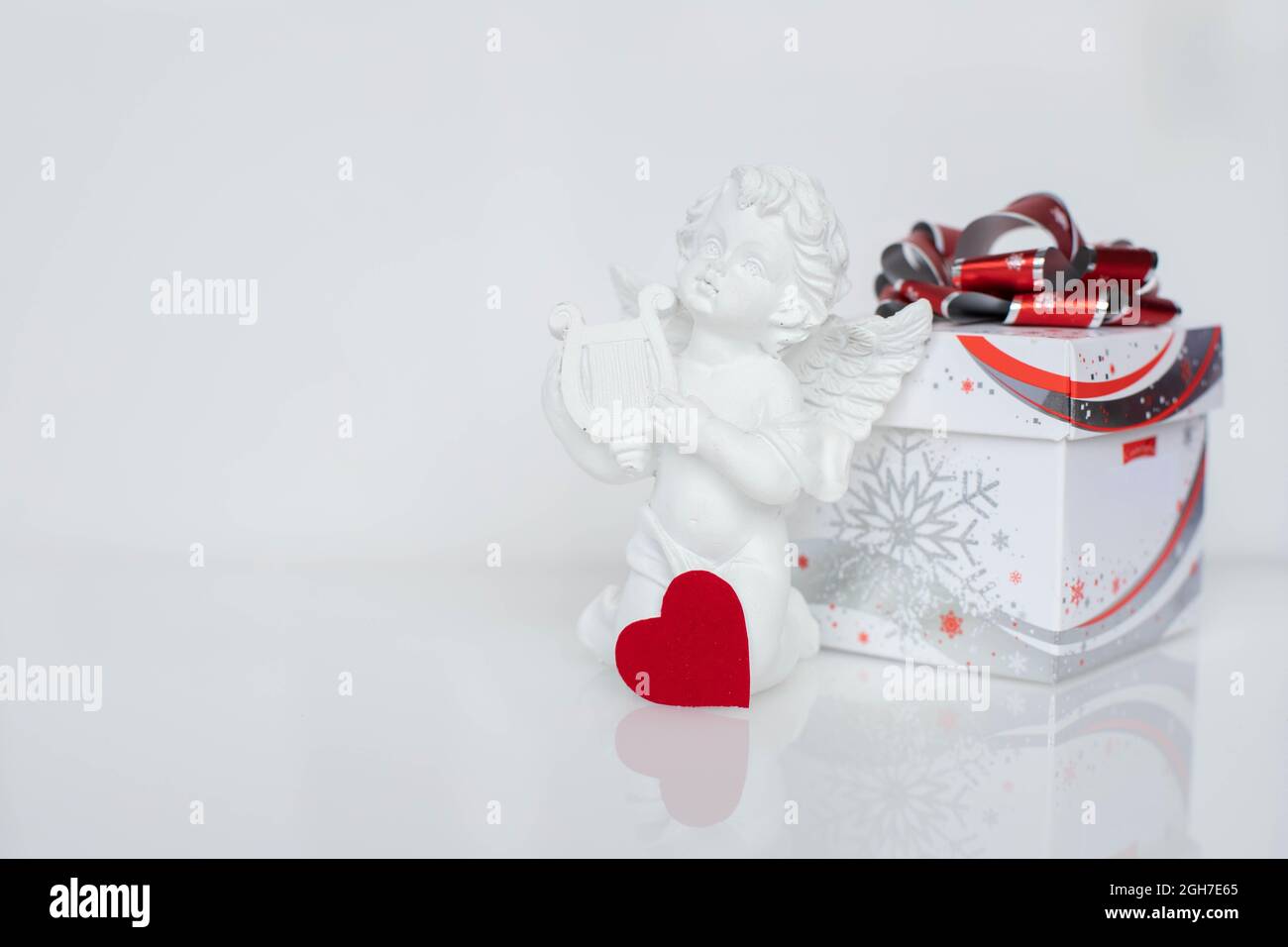 ceramic angel and gift box Stock Photo - Alamy