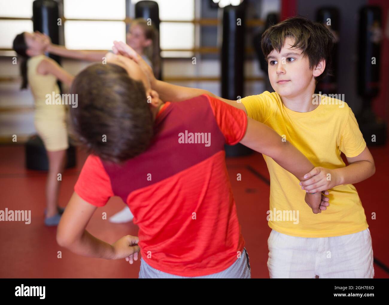 Two boys in pair practicing self-protection Stock Photo - Alamy