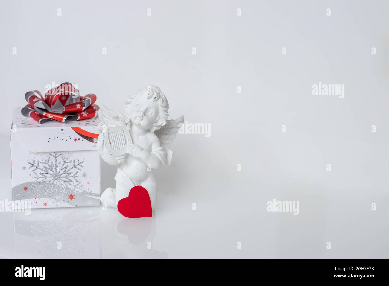 ceramic angel and gift box Stock Photo - Alamy