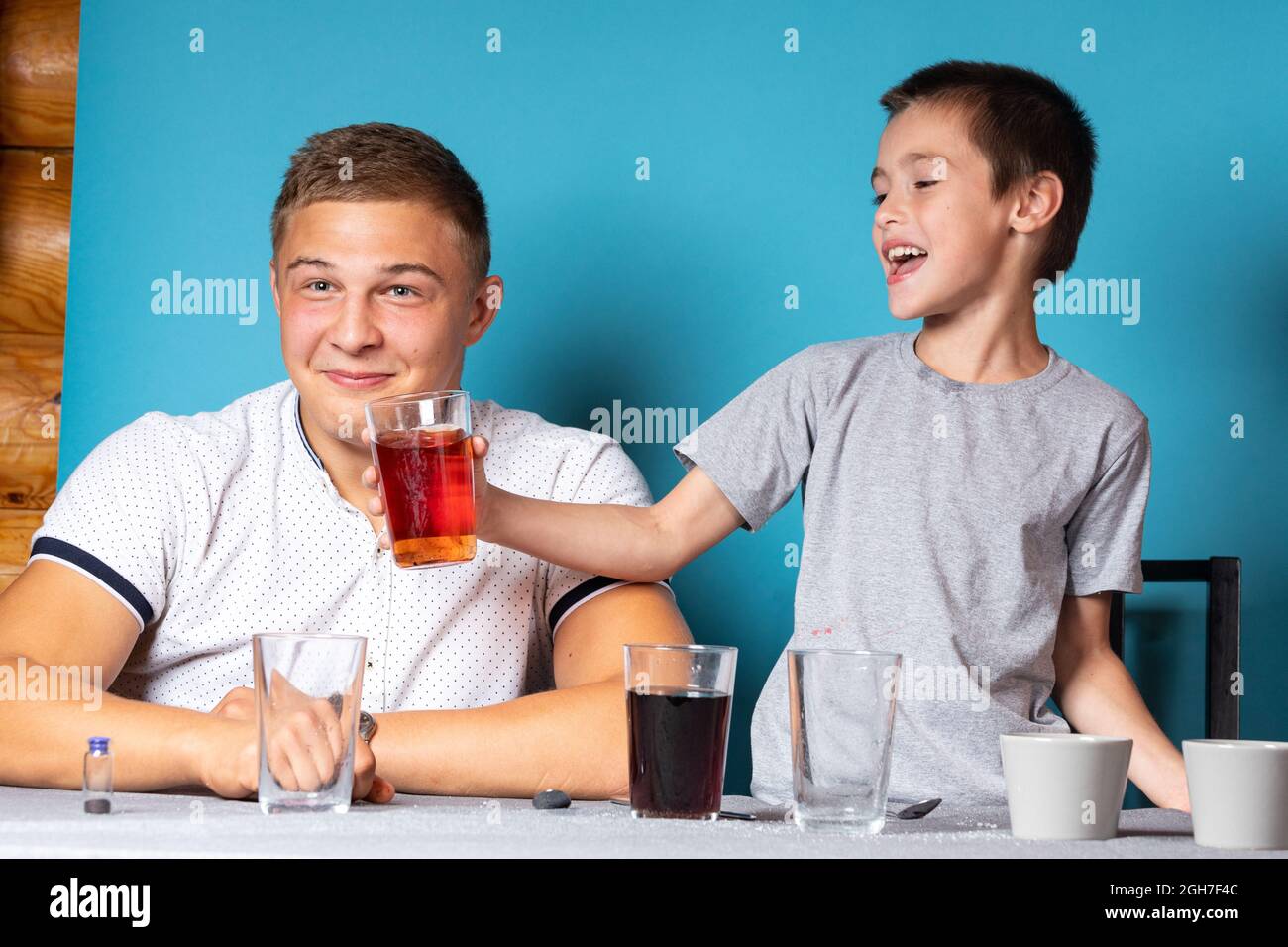 Chemistry education and training concept. Close-up of a boy and his dad ...