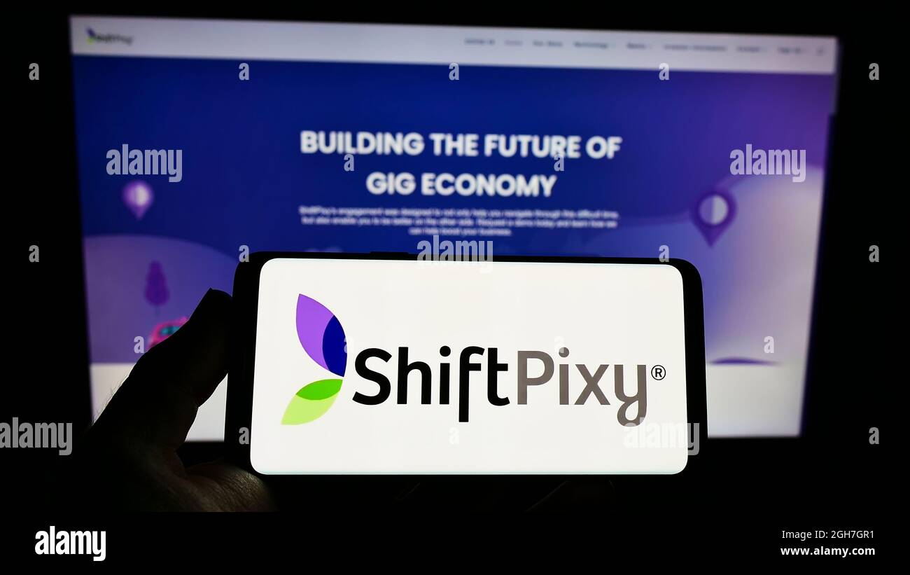 Person holding smartphone with logo of US recruitment platform company ...