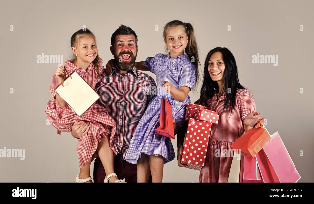 happy family go shopping together hold packages, sales Stock Photo - Alamy