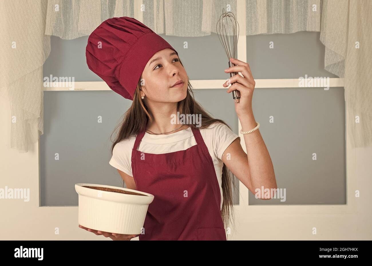 An appetite of pride. kid chef cooking with beater. child prepare ...