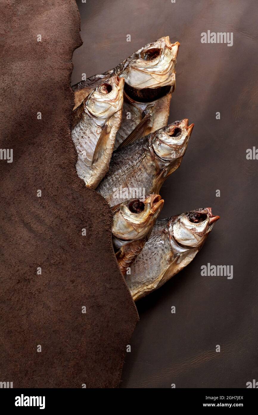 Salted sun-dried roach covered with genuine leather flap Stock Photo ...