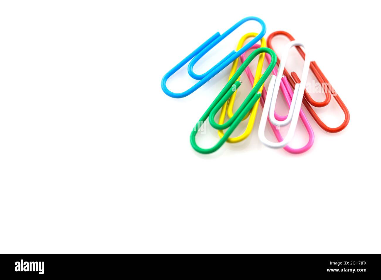 Colorful paperclips isolated on white background Stock Photo - Alamy