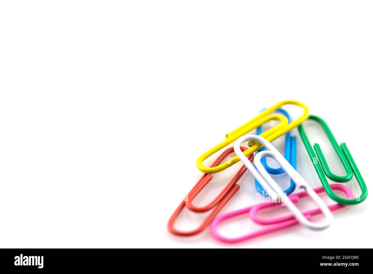 Colorful paperclips isolated on white background Stock Photo - Alamy