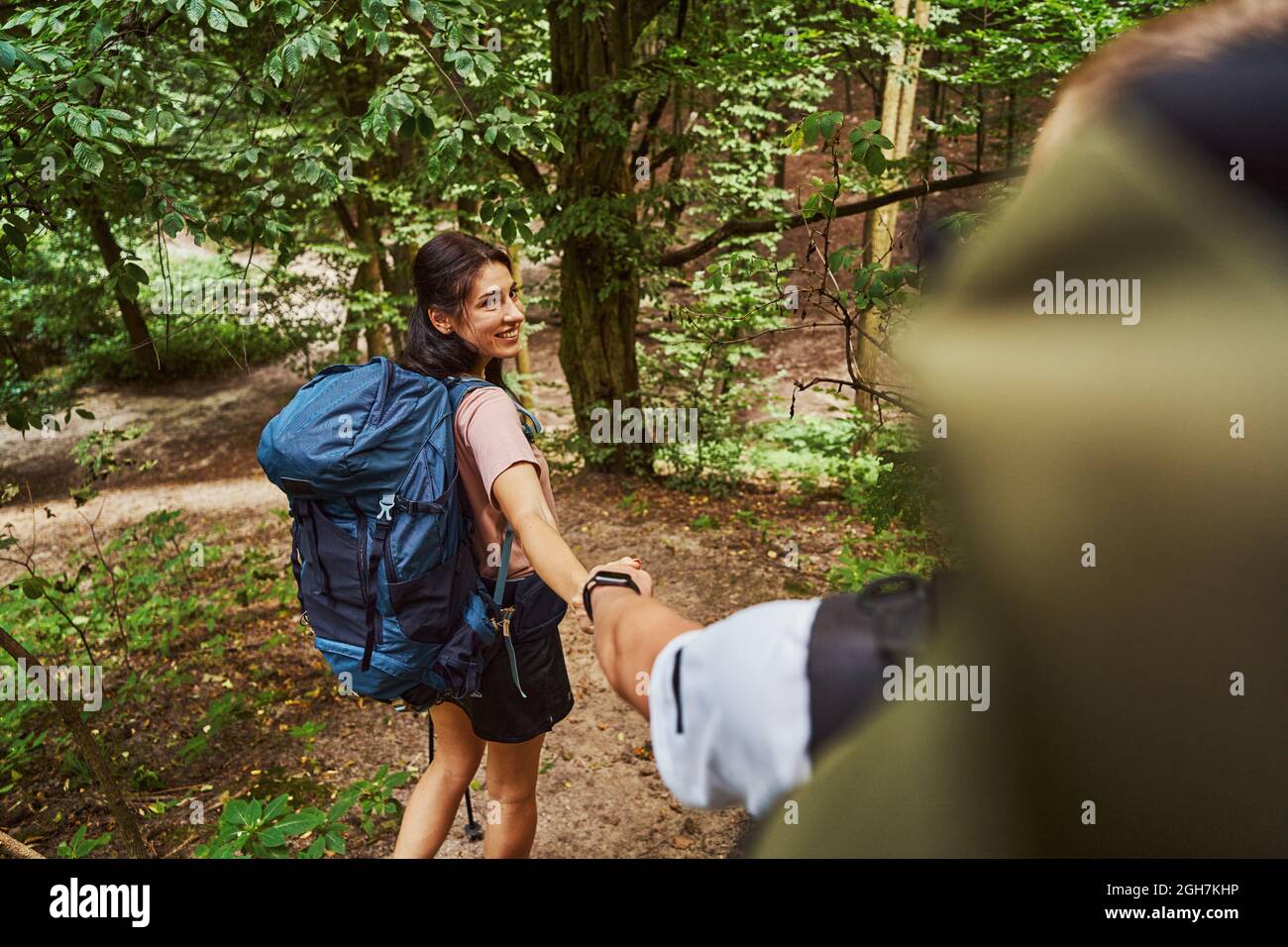 Jolly young woman enjoying romantic hiking with boyfriend Stock Photo ...