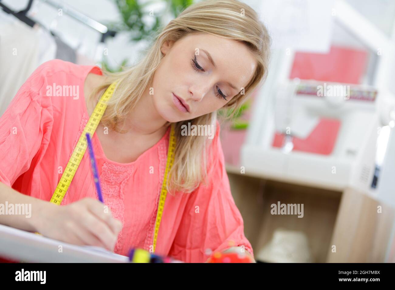 professional tailor designer drawing fashion sketch at atelier Stock ...