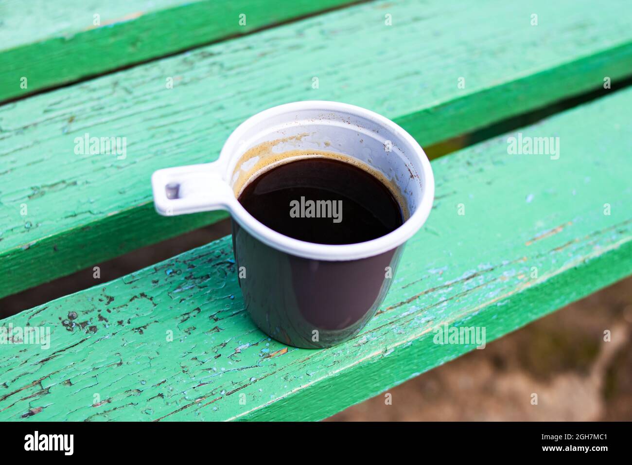 Espresso coffee on a bench in a park hi-res stock photography and ...